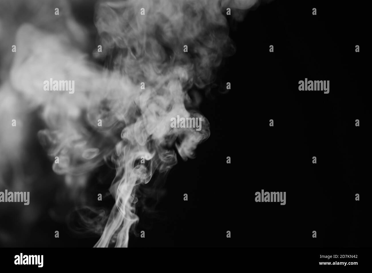 White smoke on a black background. Texture of smoke. Clubs of white ...