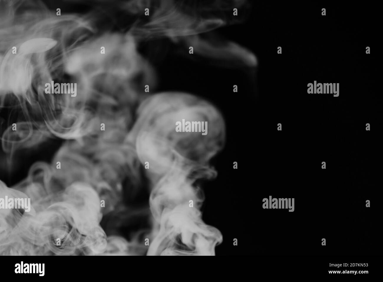 White smoke on a black background. Texture of smoke. Clubs of white ...