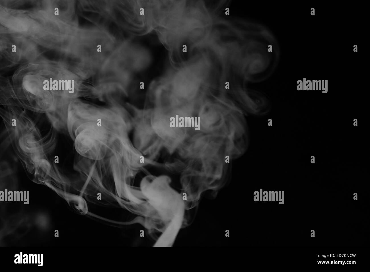 White smoke on a black background. Texture of smoke. Clubs of white ...