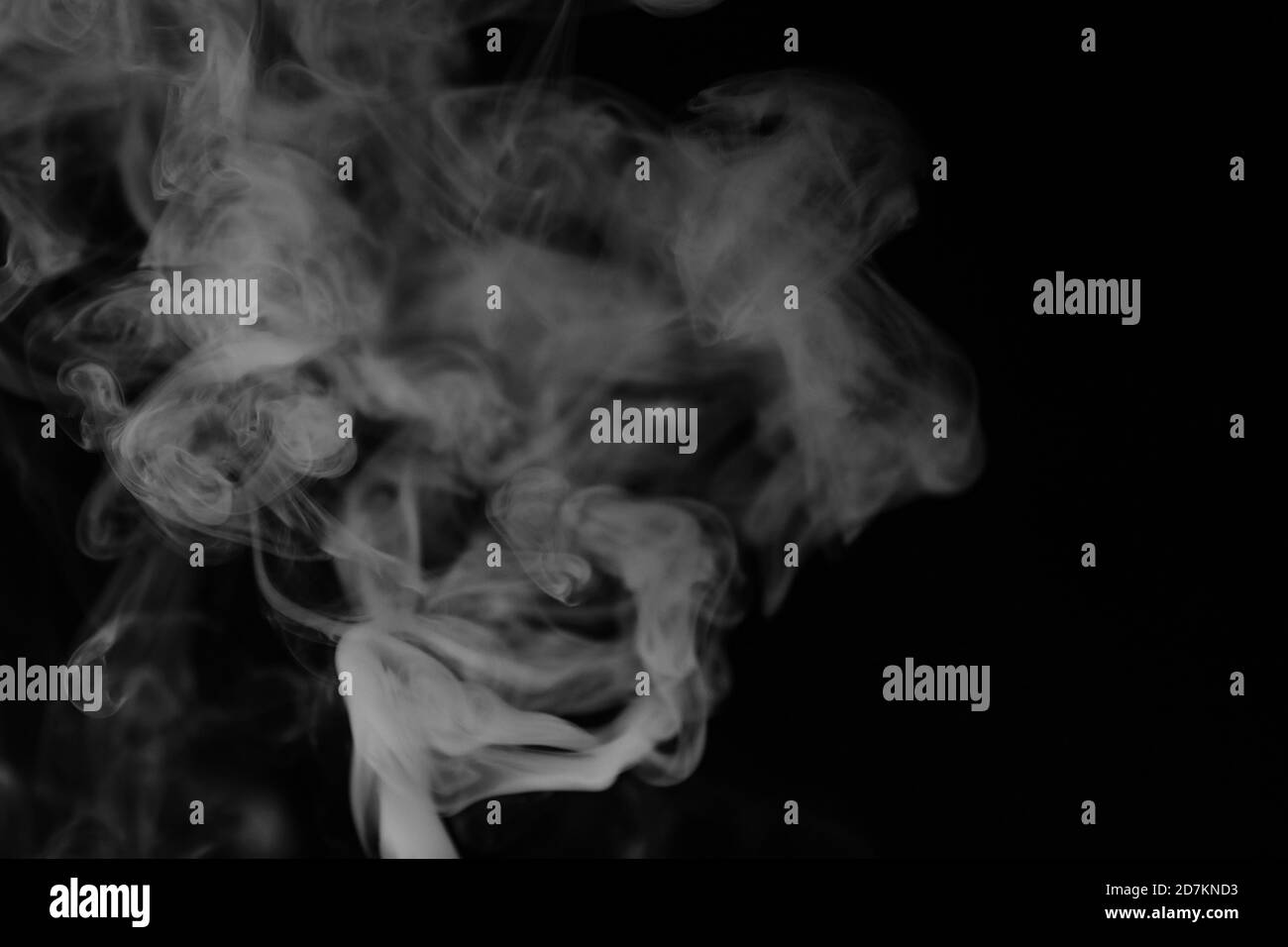 White smoke on a black background. Texture of smoke. Clubs of white ...