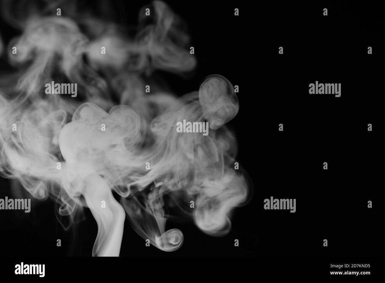 White smoke on a black background. Texture of smoke. Clubs of white ...