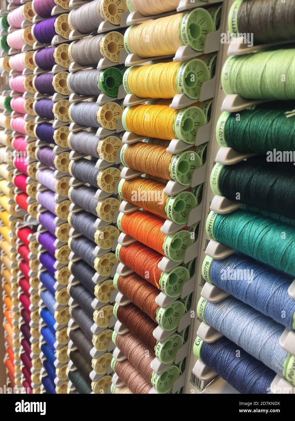 background Colorful reels of threads background - A series of ...