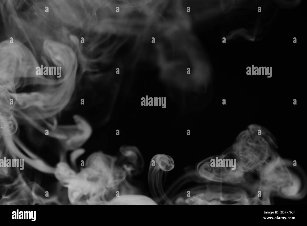 White smoke on a black background. Texture of smoke. Clubs of white ...