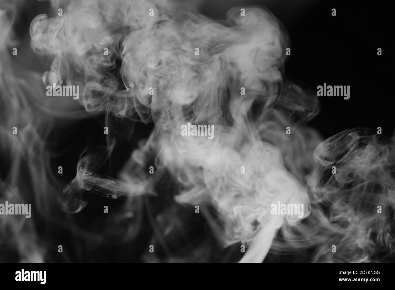 White smoke on a black background. Texture of smoke. Clubs of white ...