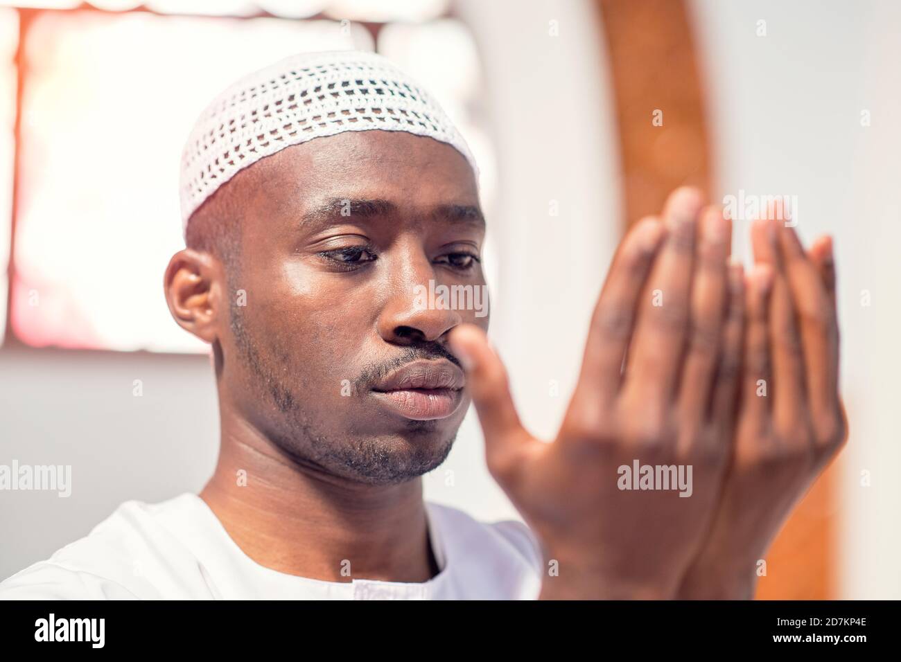 Religious black muslim man praying inside the mosque Stock Photo - Alamy