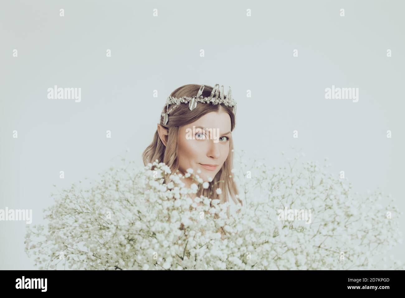 Perfect elf woman with white flowers. Mysterious elven sorceress ...