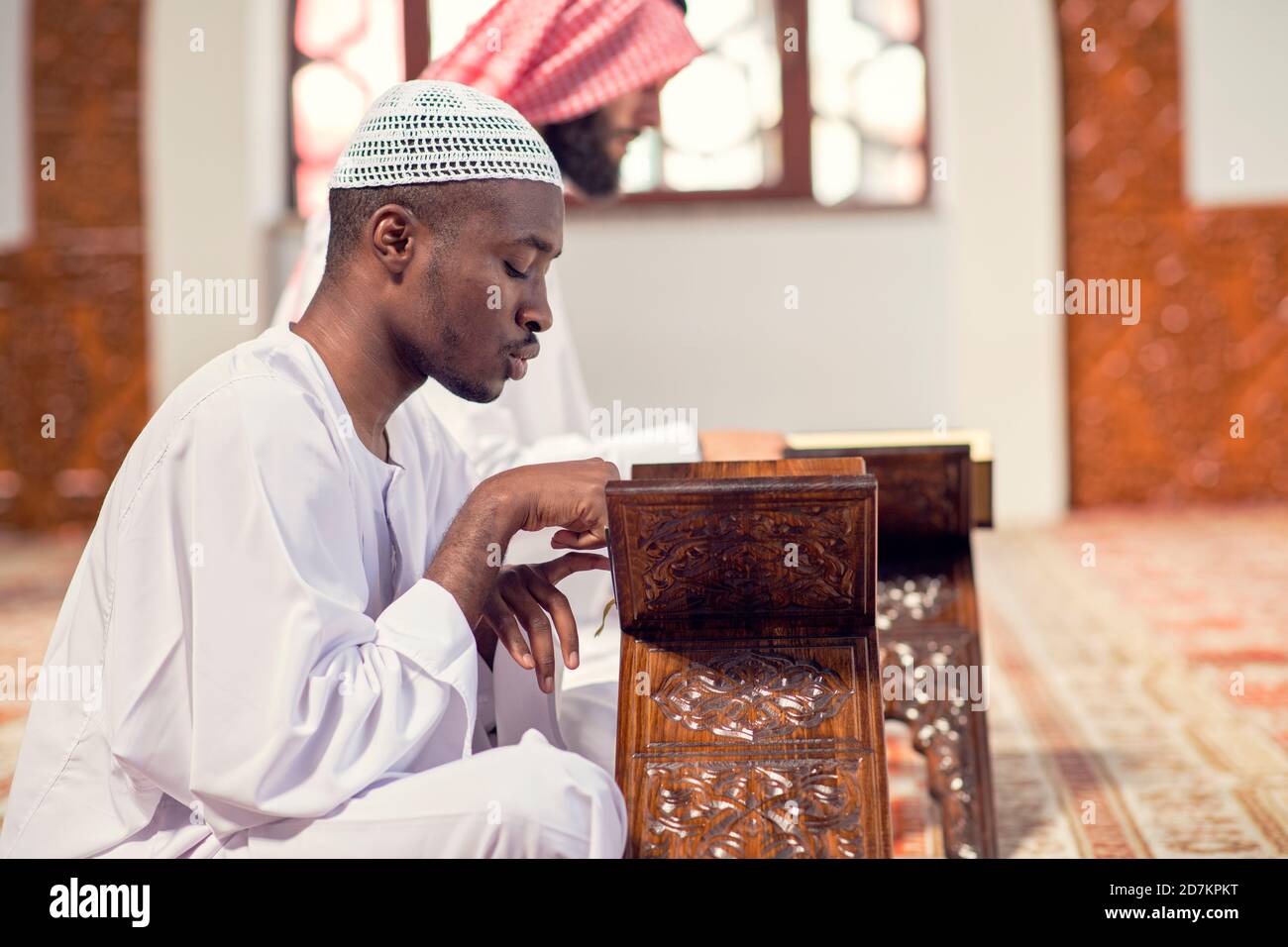 Two religious muslim man praying together inside the mosque Stock Photo ...