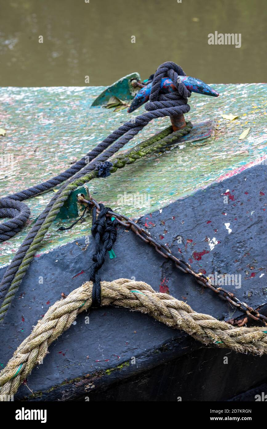 atmospheric old boat with anchor and ropes with chains and cleats rusty ...