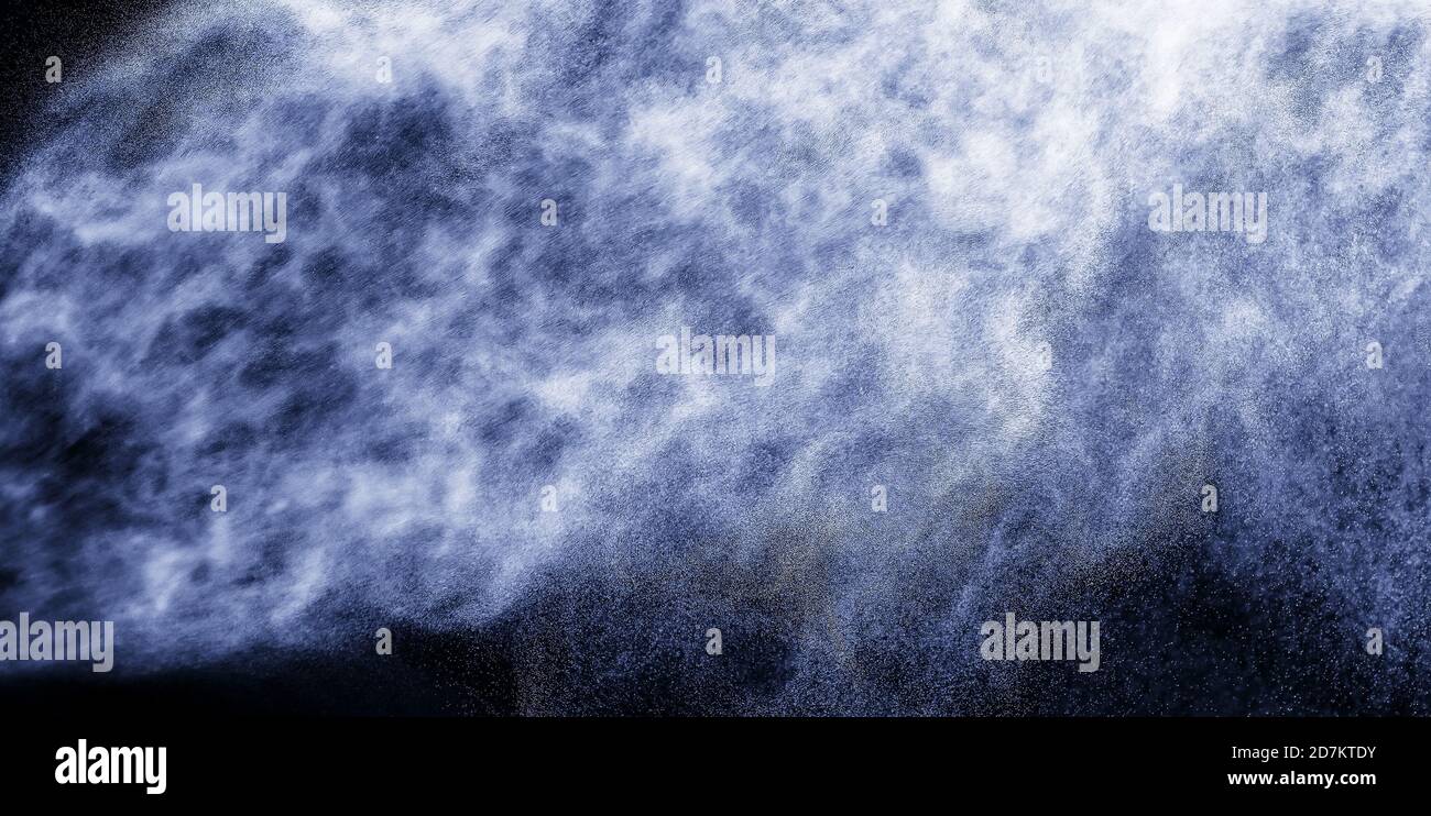 A stream of water and a cloud of drops Stock Photo - Alamy