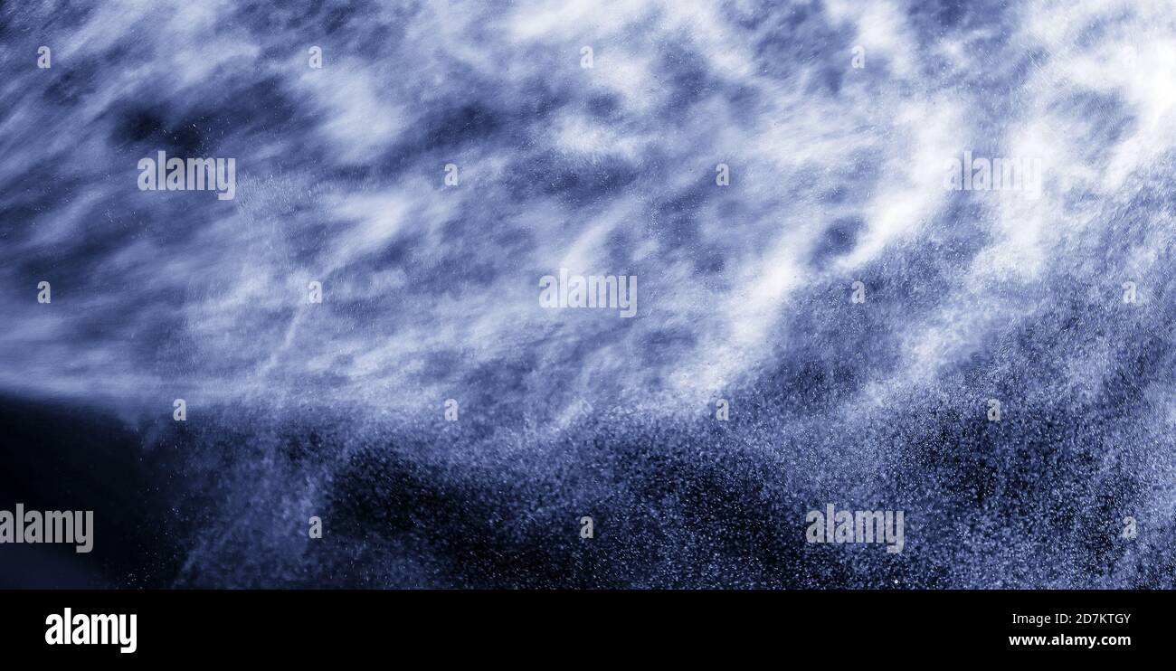 A stream of water and a cloud of drops Stock Photo - Alamy