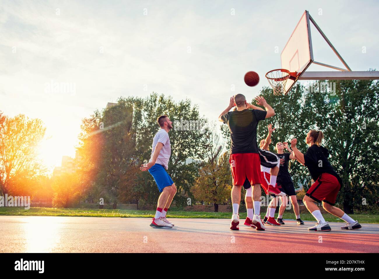 Group Of Young Friends Playing Basketball Match Stock Photo - Alamy