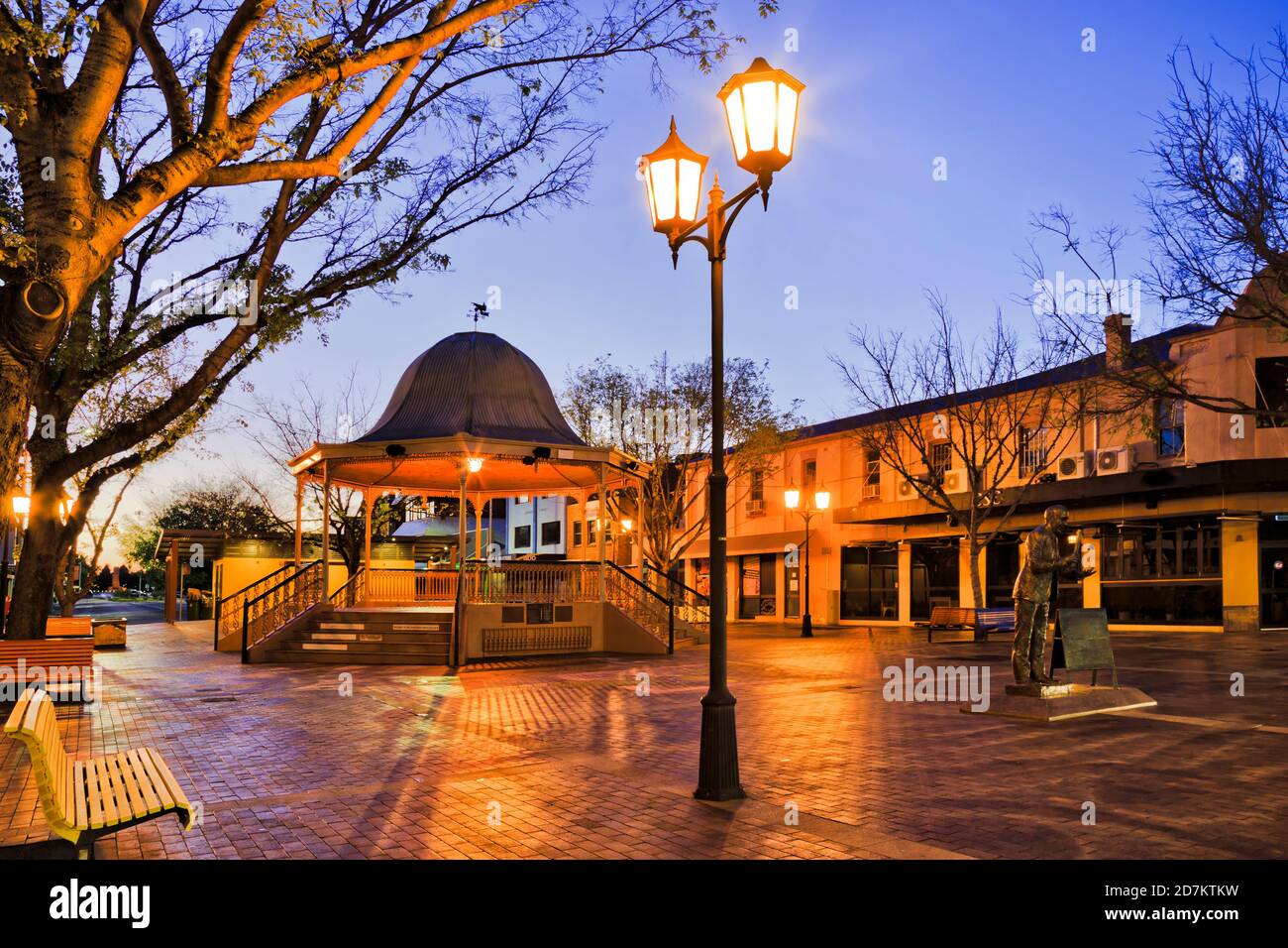 Round rotunda on Church street of Dubbo city at sunrise lit by street ...