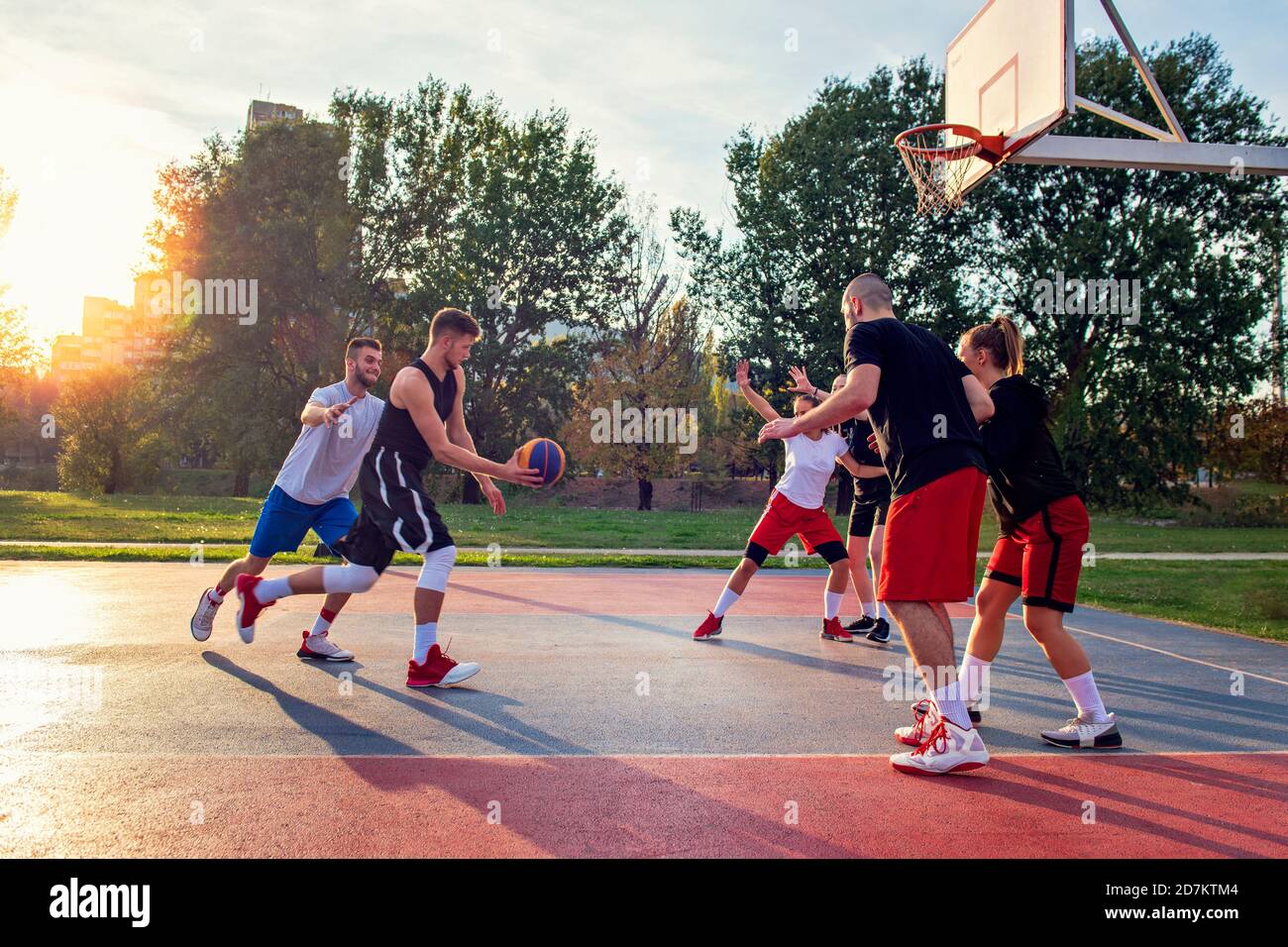 Group Of Young Friends Playing Basketball Match Stock Photo - Alamy
