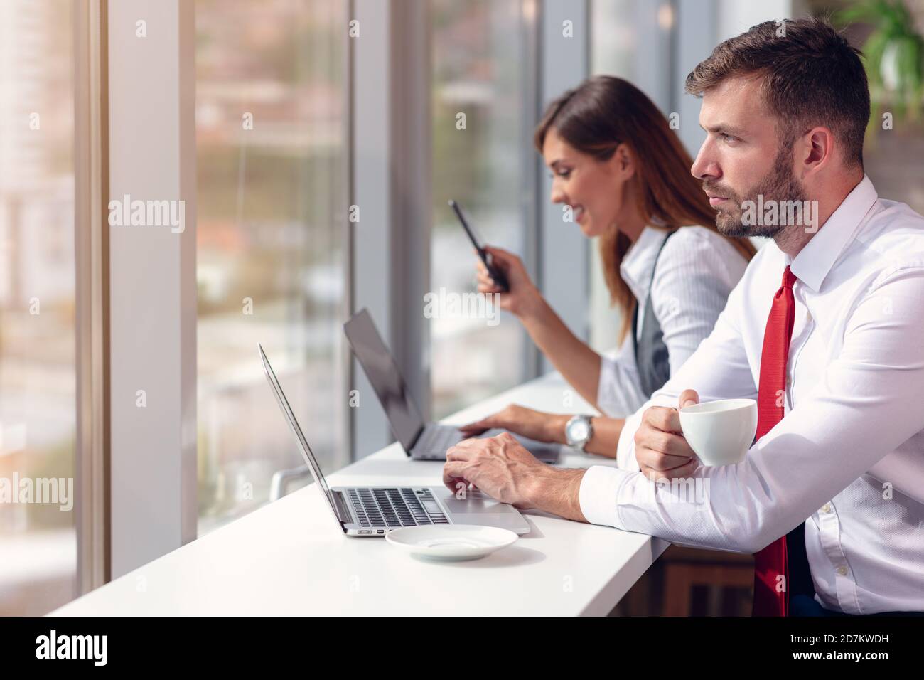 Happy Business people working together on computer Stock Photo - Alamy