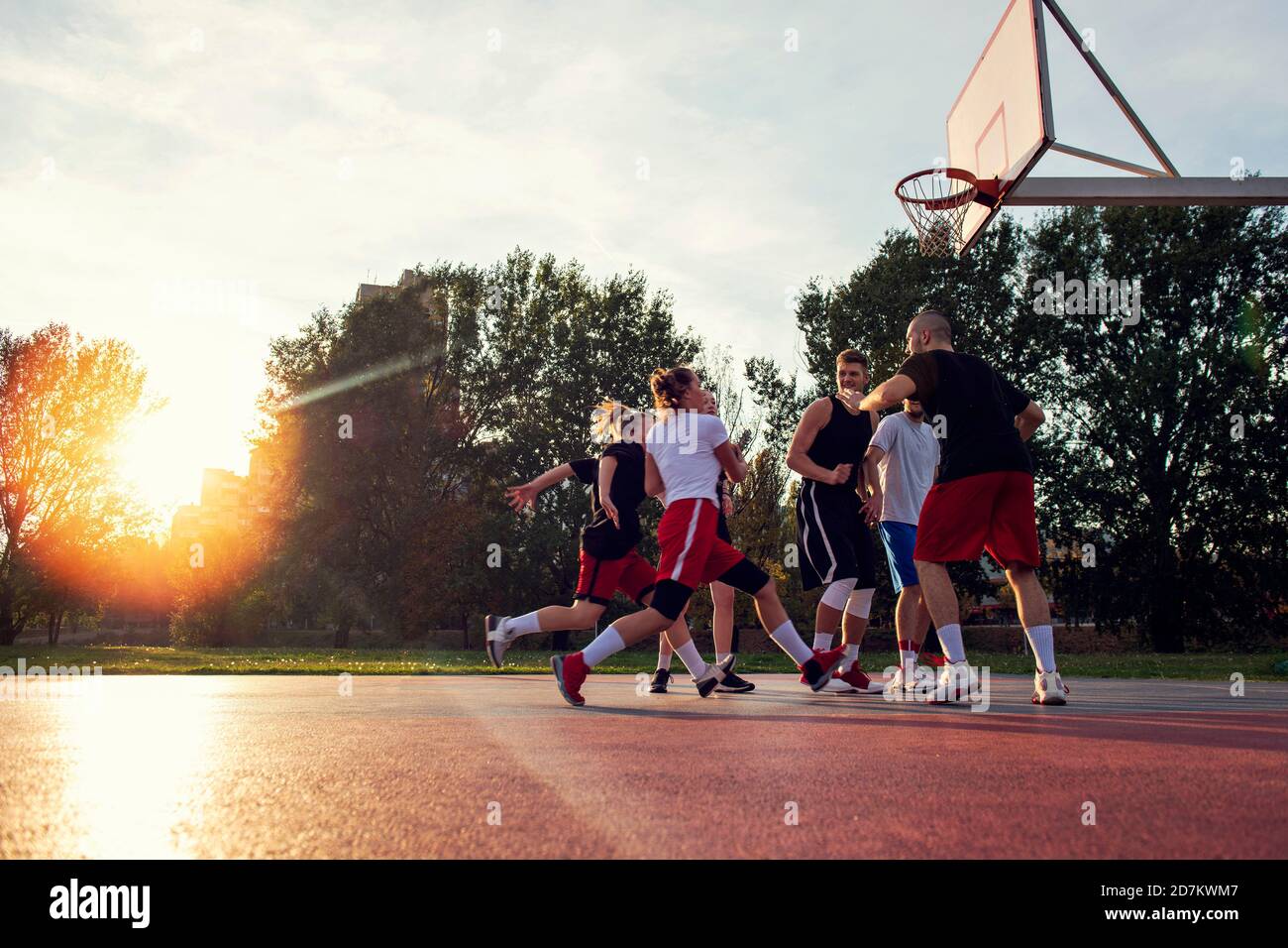 Group Of Young Friends Playing Basketball Match Stock Photo - Alamy