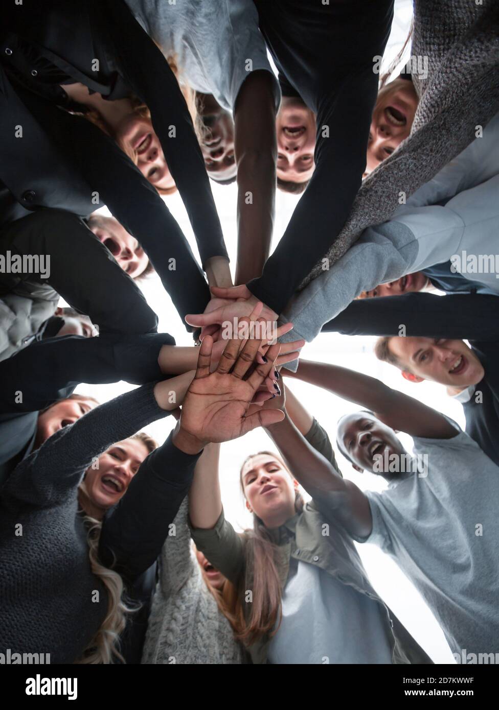 bottom view. group of happy young people making a stack of hands Stock ...
