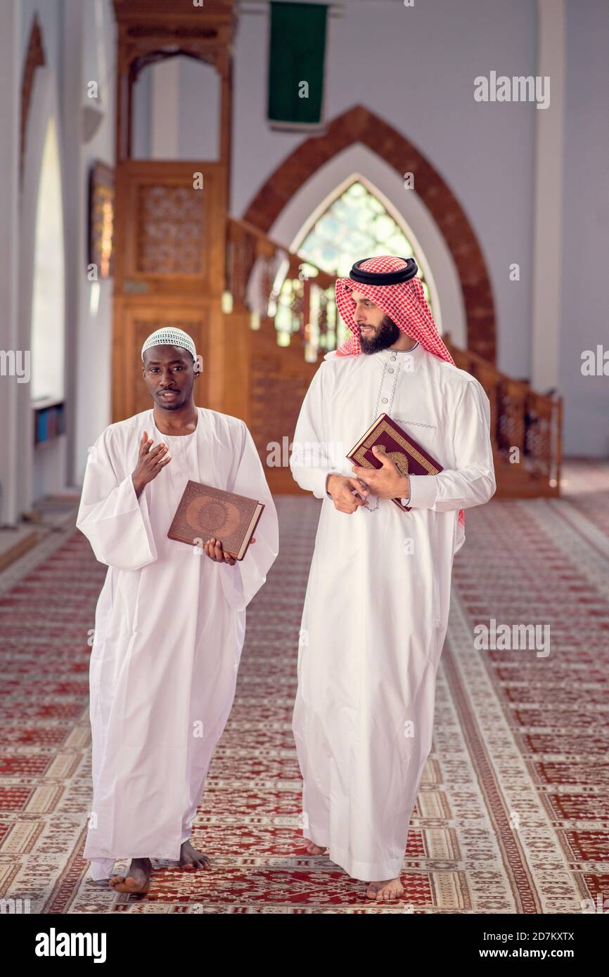 Two religious muslim man praying together inside the mosque Stock Photo ...