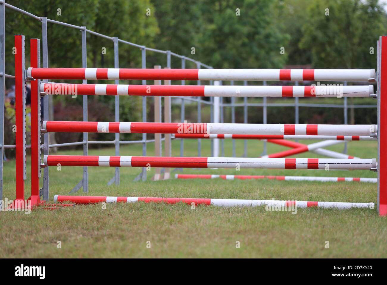 Colorful image of show jumping poles at an open air show jumping arena ...