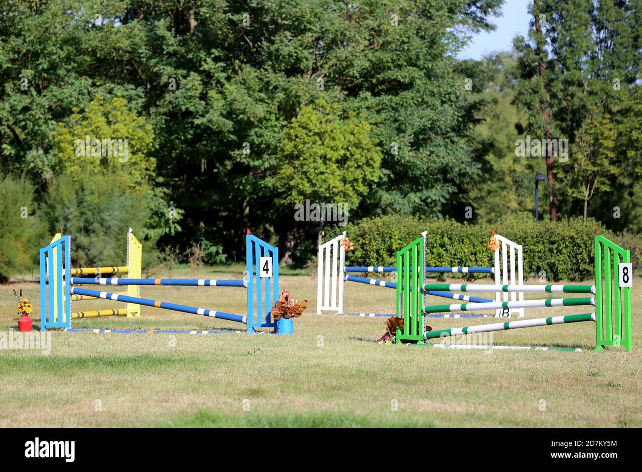 Colorful image of show jumping poles at an open air show jumping arena ...
