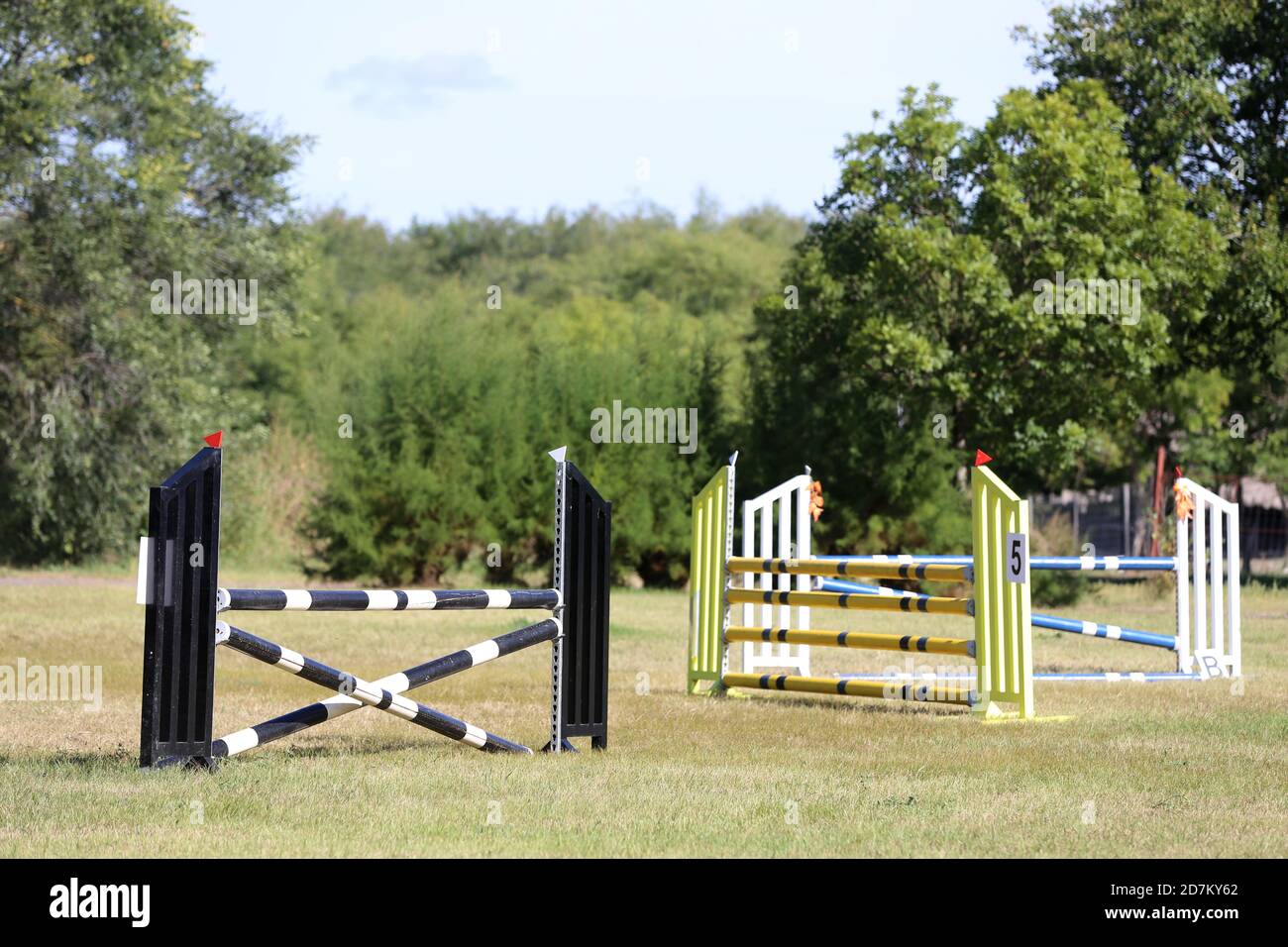 Colorful image of show jumping poles at an open air show jumping arena ...