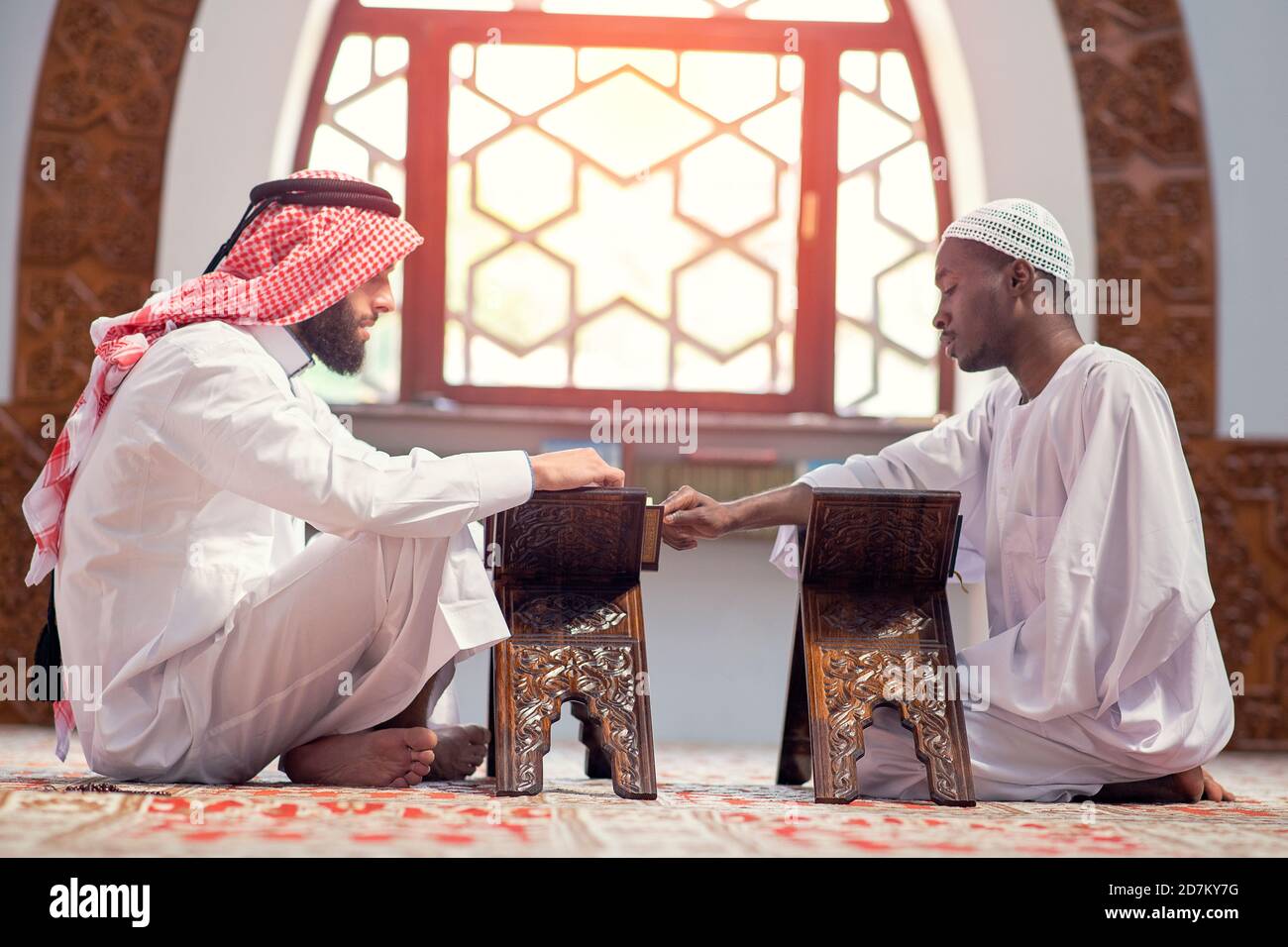 Two religious muslim man praying together inside the mosque Stock Photo ...