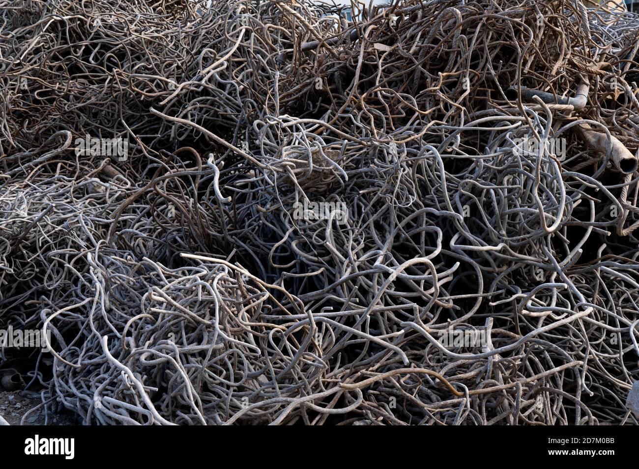 Heap of construction scrap debris Armature iron round rods pieces of ...