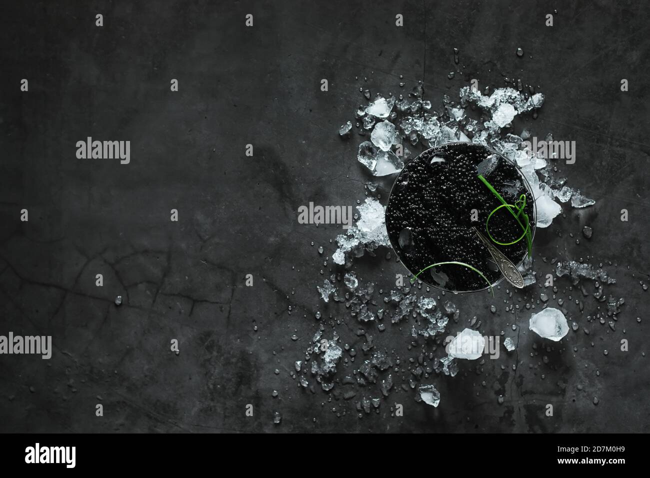 Fresh black fish roe. Beluga caviar served with ice Stock Photo - Alamy