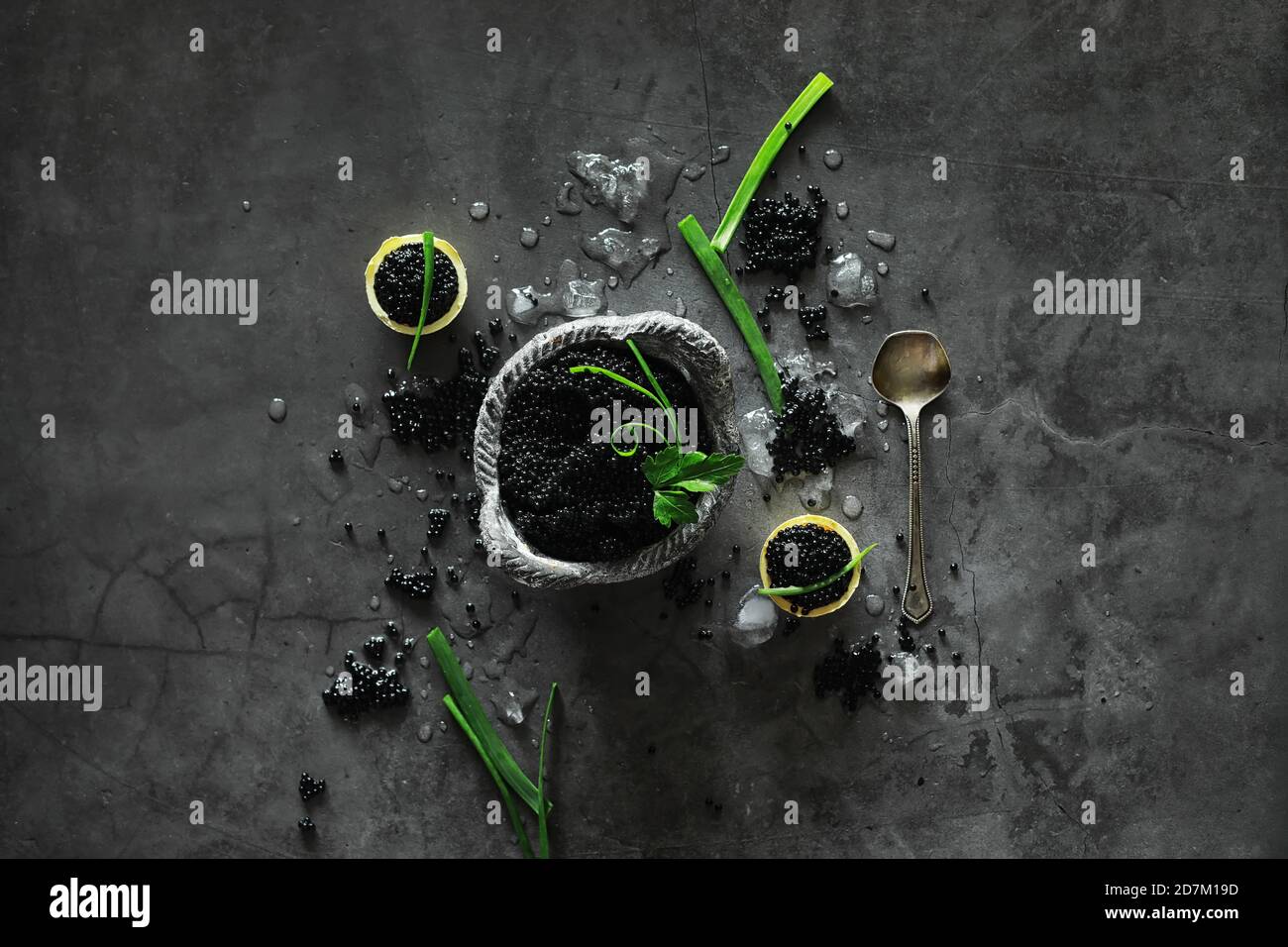 Fresh black fish roe. Beluga caviar served with ice Stock Photo - Alamy