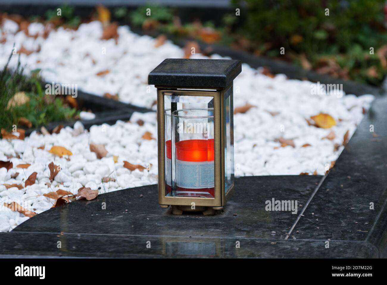modern metal grave lantern with burning candle on a grave Stock Photo ...
