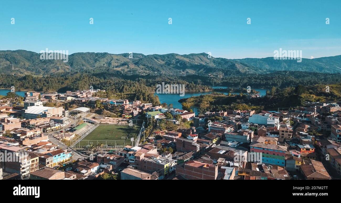 Aerial view of a town in El Penol, Guatape, Colombia on a clear sky ...
