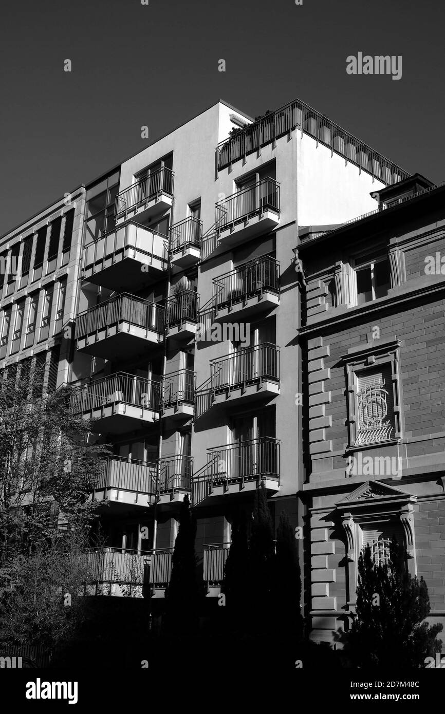 Grayscale shot of a residential building under the sunlight at daytime ...