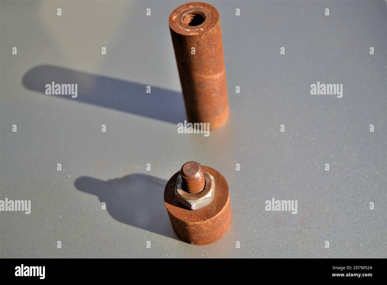Rusted steel mile and hexagonal nut. Rusted metal exposed to corrosion ...