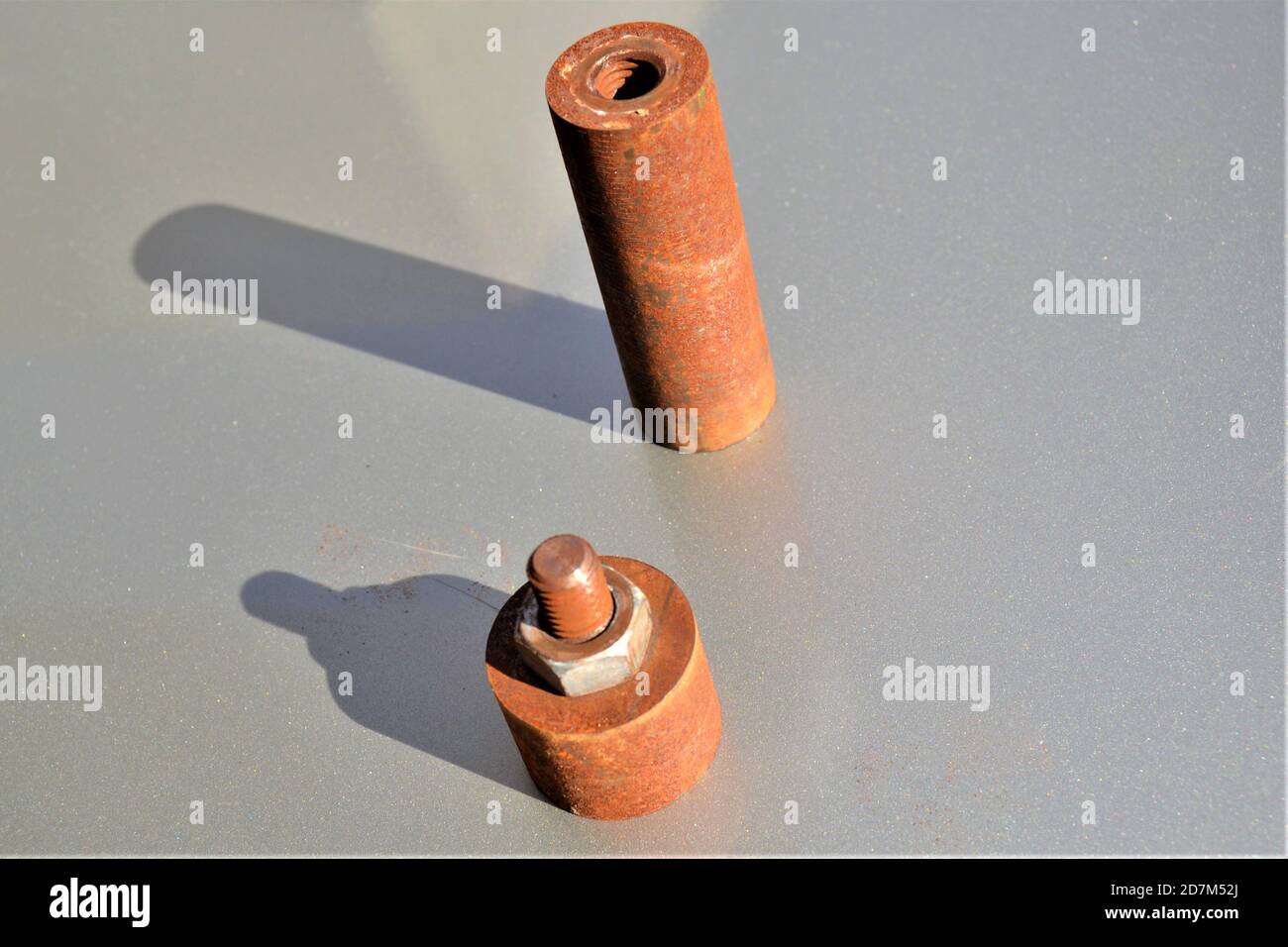 Rusted steel mile and hexagonal nut. Rusted metal exposed to corrosion ...