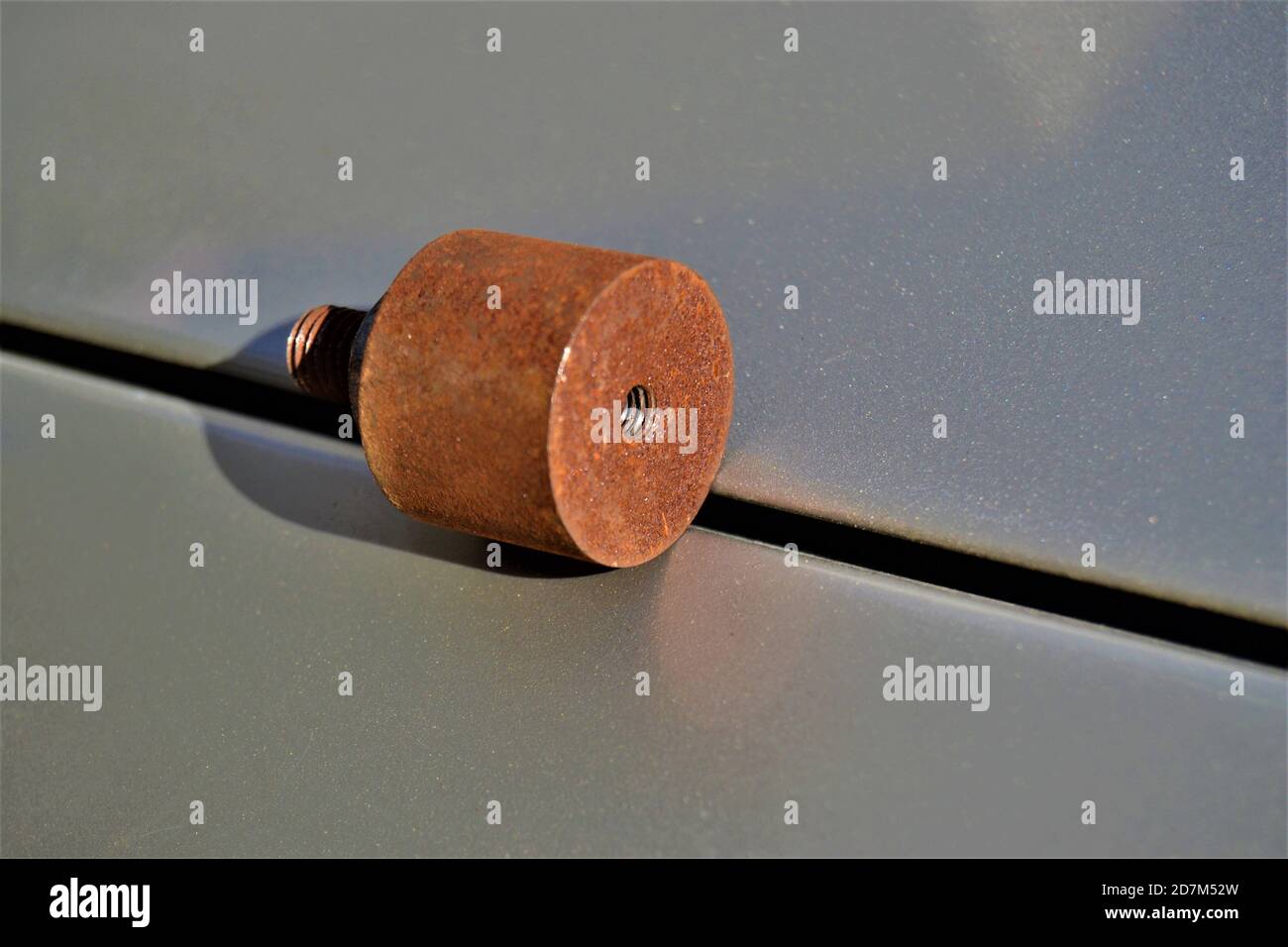 Rusted steel mile and hexagonal nut. Rusted metal exposed to corrosion ...