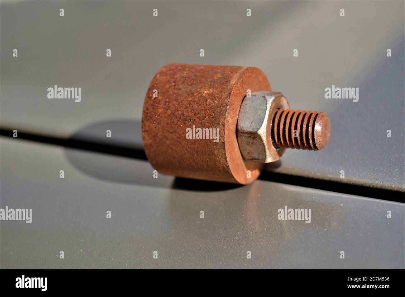 Rusted steel mile and hexagonal nut. Rusted metal exposed to corrosion ...