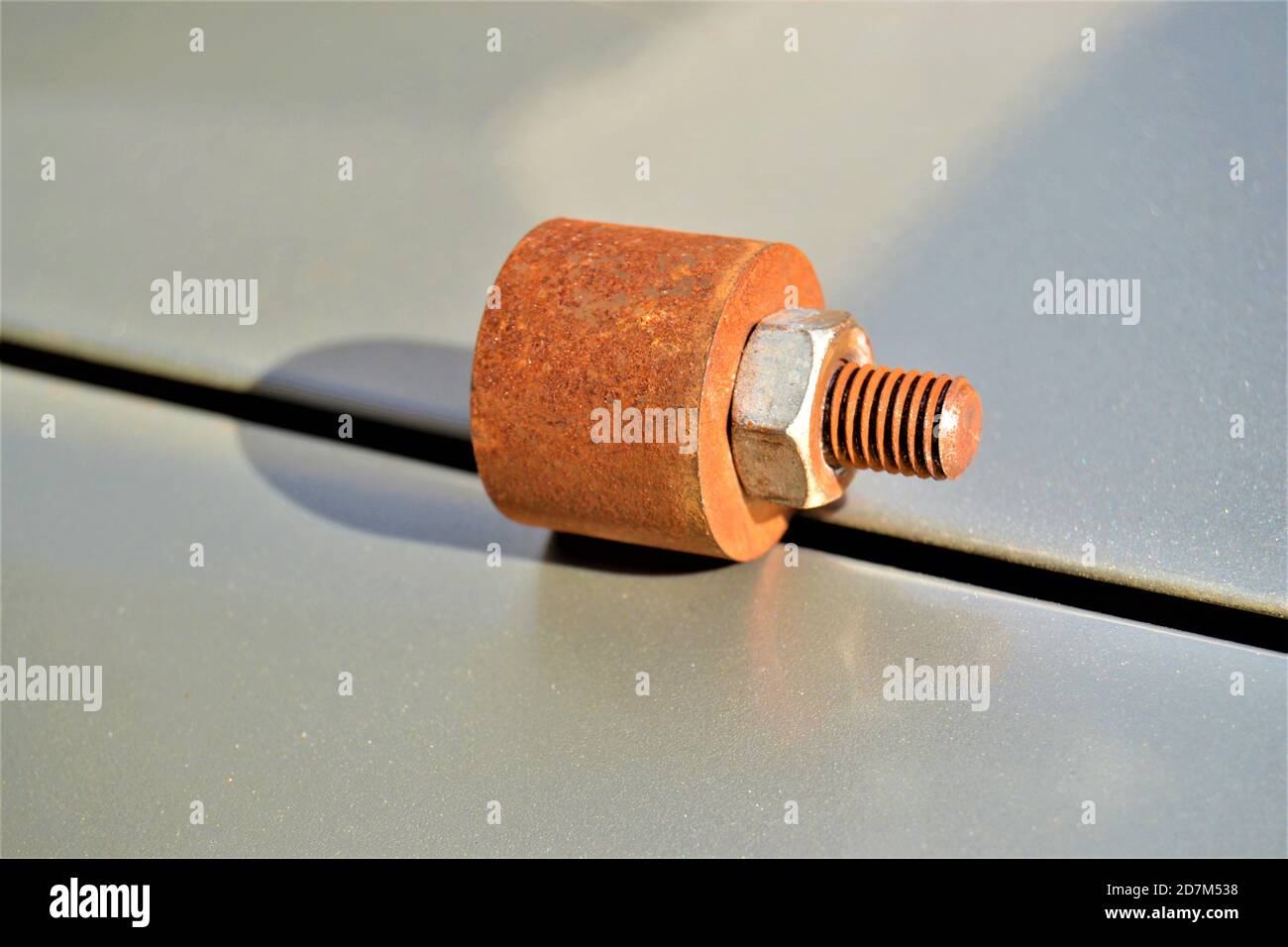 Rusted steel mile and hexagonal nut. Rusted metal exposed to corrosion ...