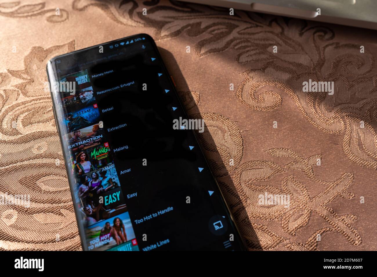 Tv shows and movie displayed on a smartphone screen. Netflix app Stock ...