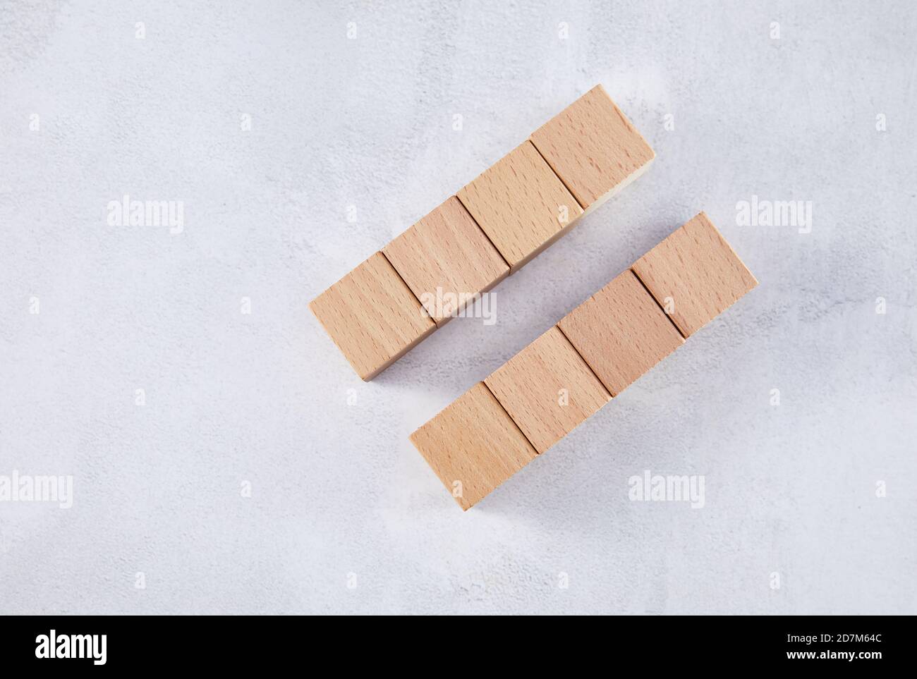 Rows of four blank wooden blocks on a light blue background Stock Photo ...