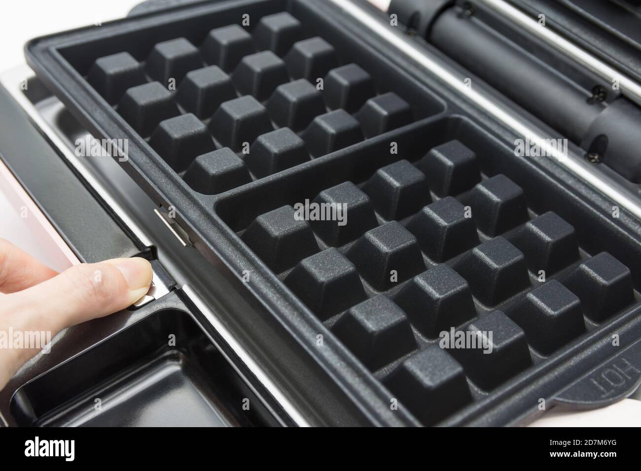 Modern waffle maker with removable plates isolated on the white ...