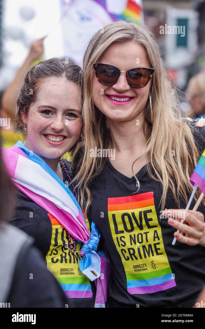 Two women with Amnesty International marching during the Toronto LGBTQ ...