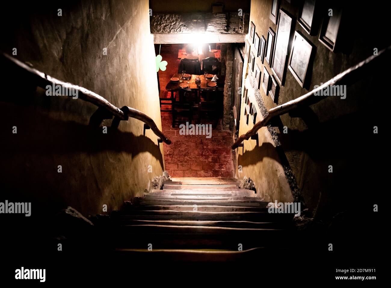 Dramatic point of view of scary stairs from upside into darkness of ...