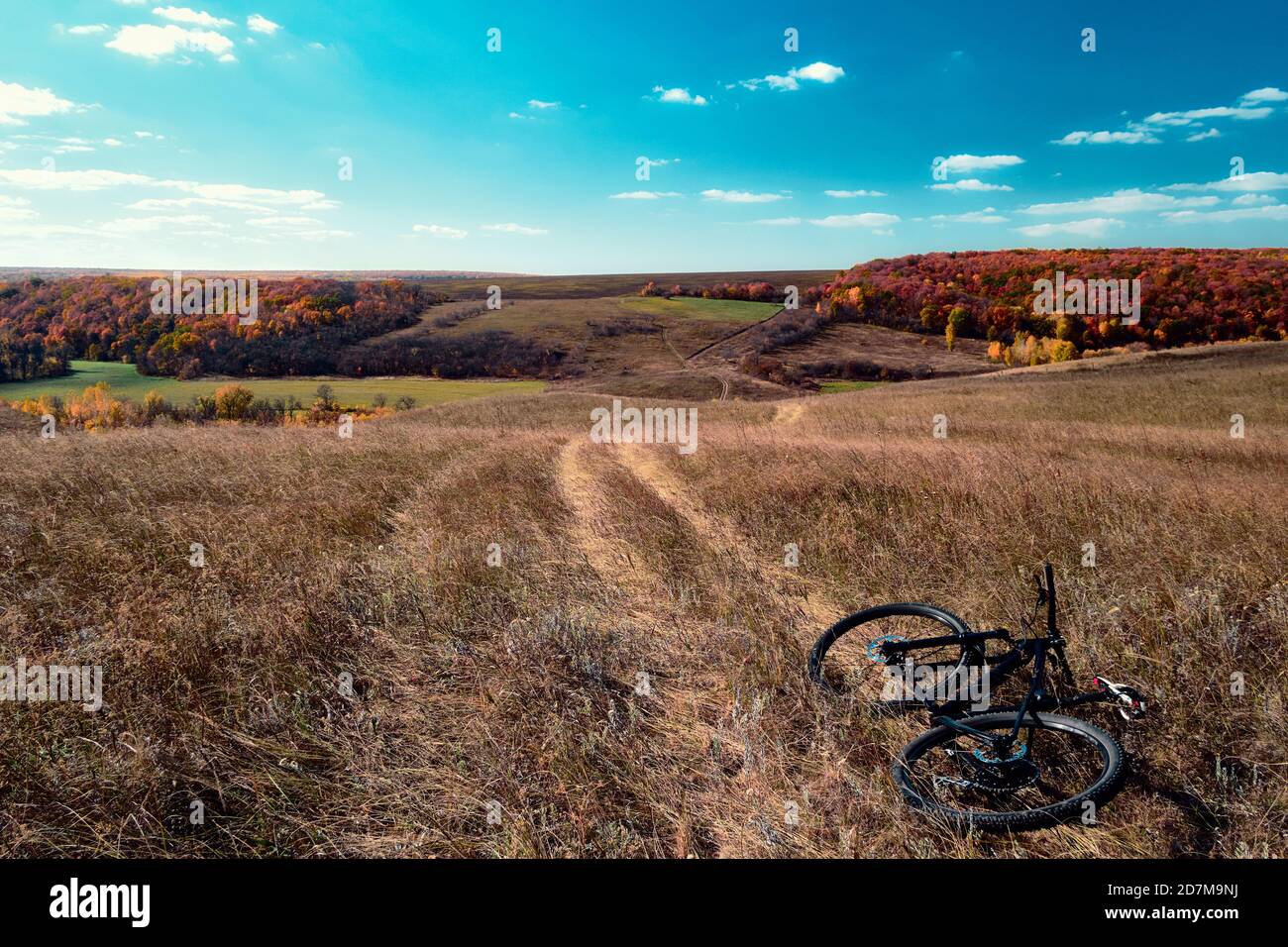 Outdoor cycling. Mountain bike in wild nature landscape background ...