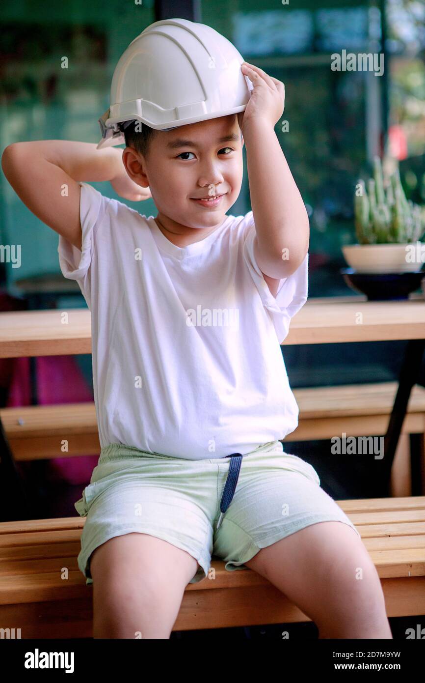 asian children wearing engineer helmet with smiling face Stock Photo ...