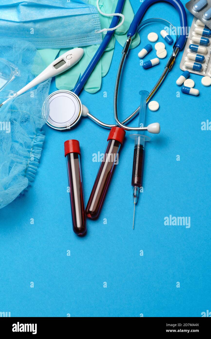 Top view of Medical equipment and tools on blue background ...