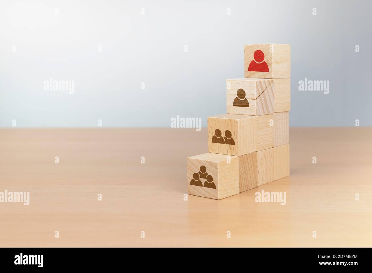 Hand arranging wood block stacking as step stair. Ladder career path ...