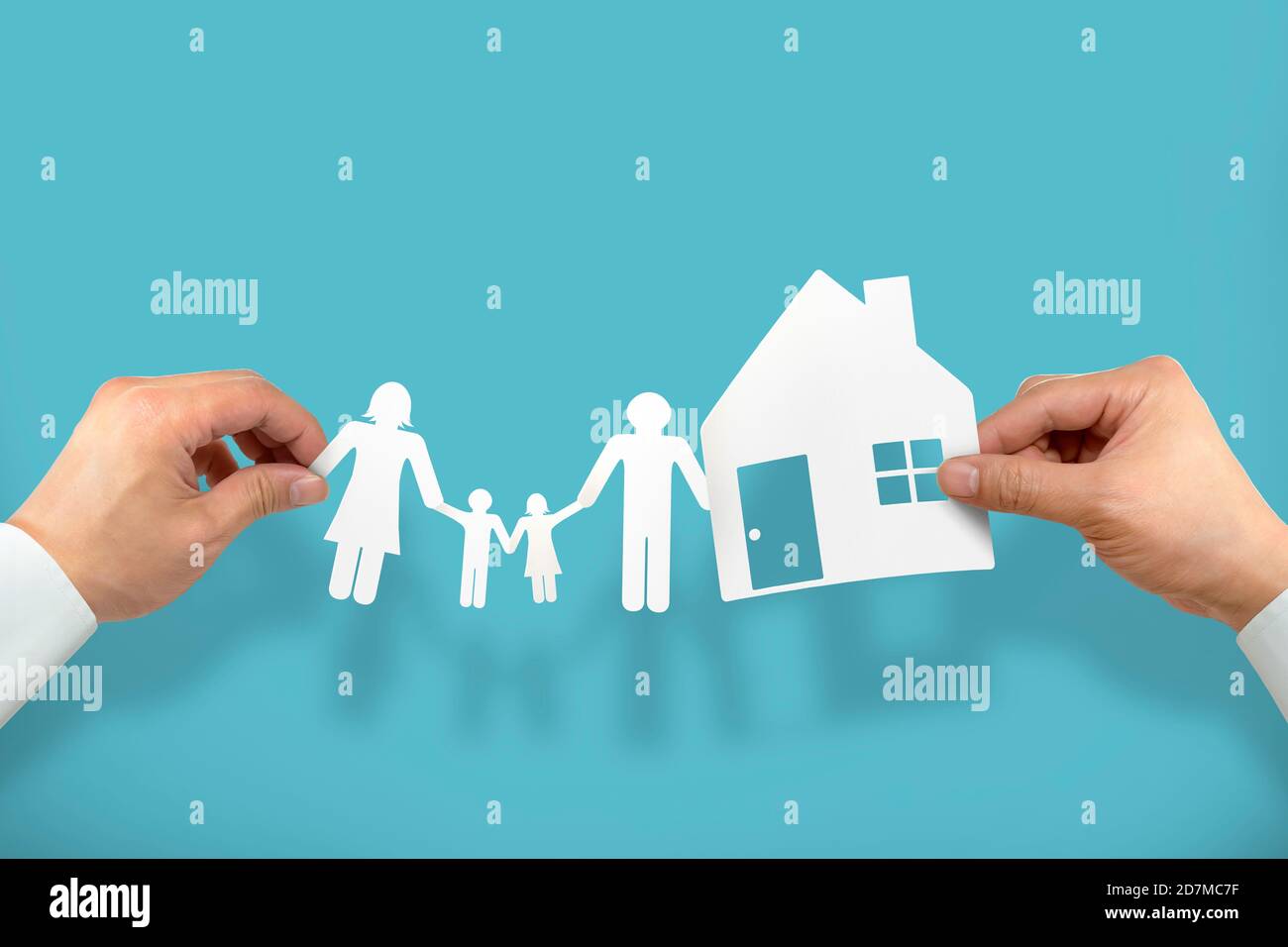 Hand hold house and family Stock Photo - Alamy