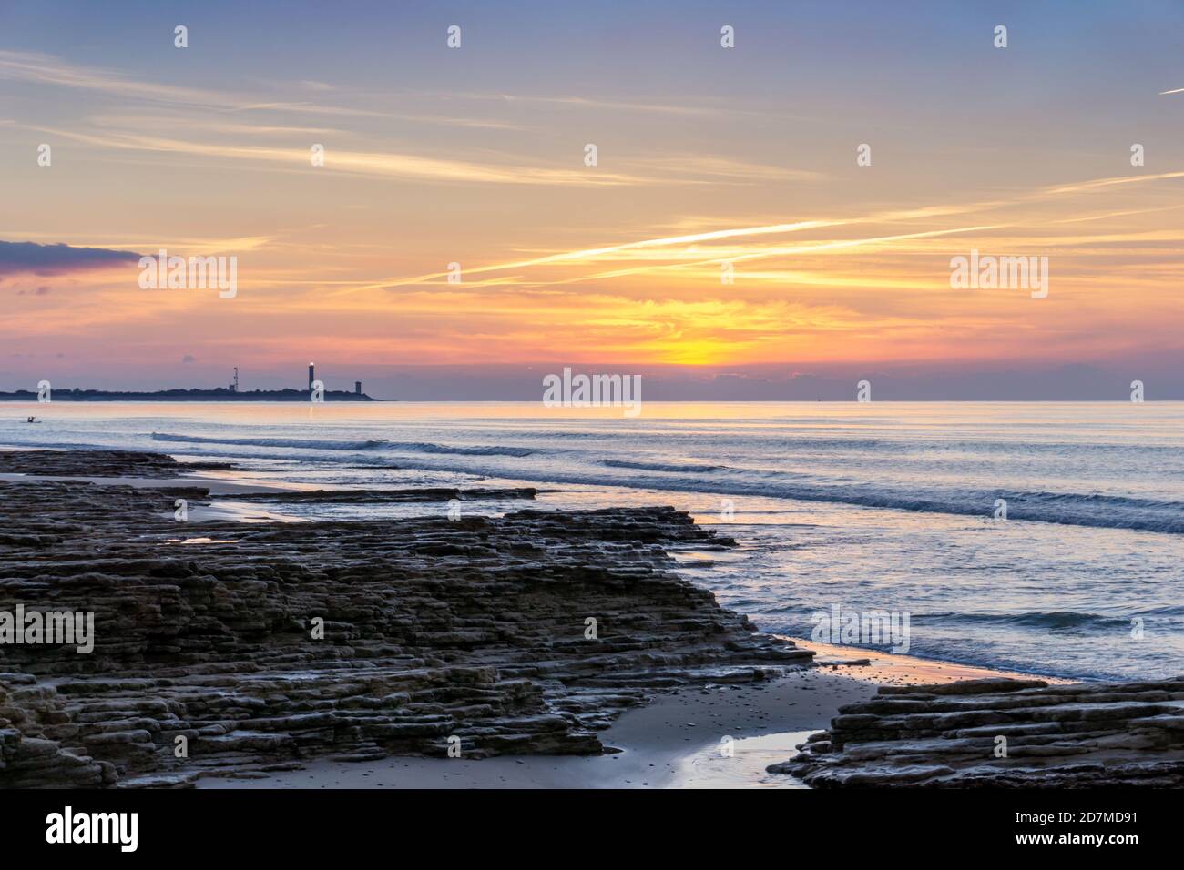 A beautiful sunset on the Atlantic coast of France on the Ile de with ...