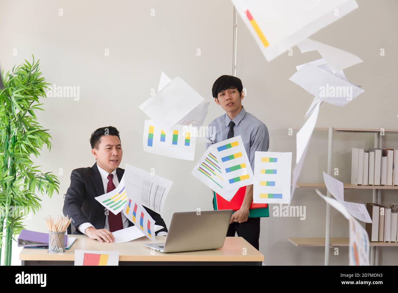 An angry Asian manager, his employees unable to work as expected ...