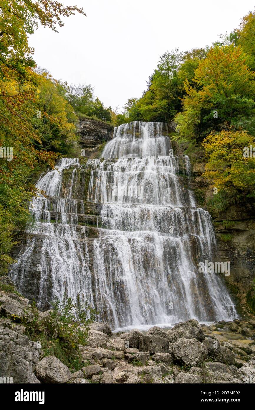 A beautiful autumn forest landscape with idyllic waterfall and pool ...