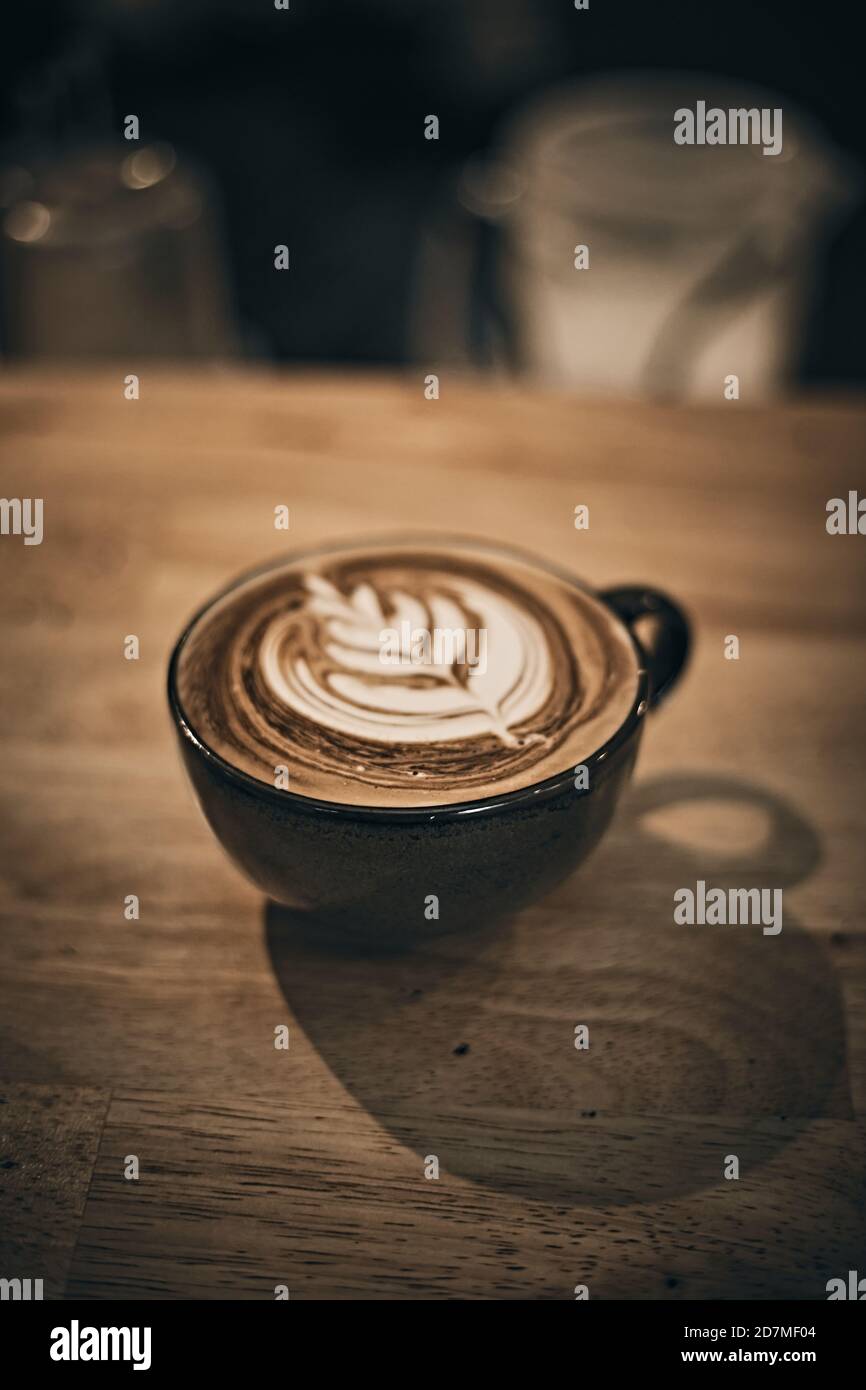 Selective focus cup of hot latte art coffee,focus at white foam Stock ...